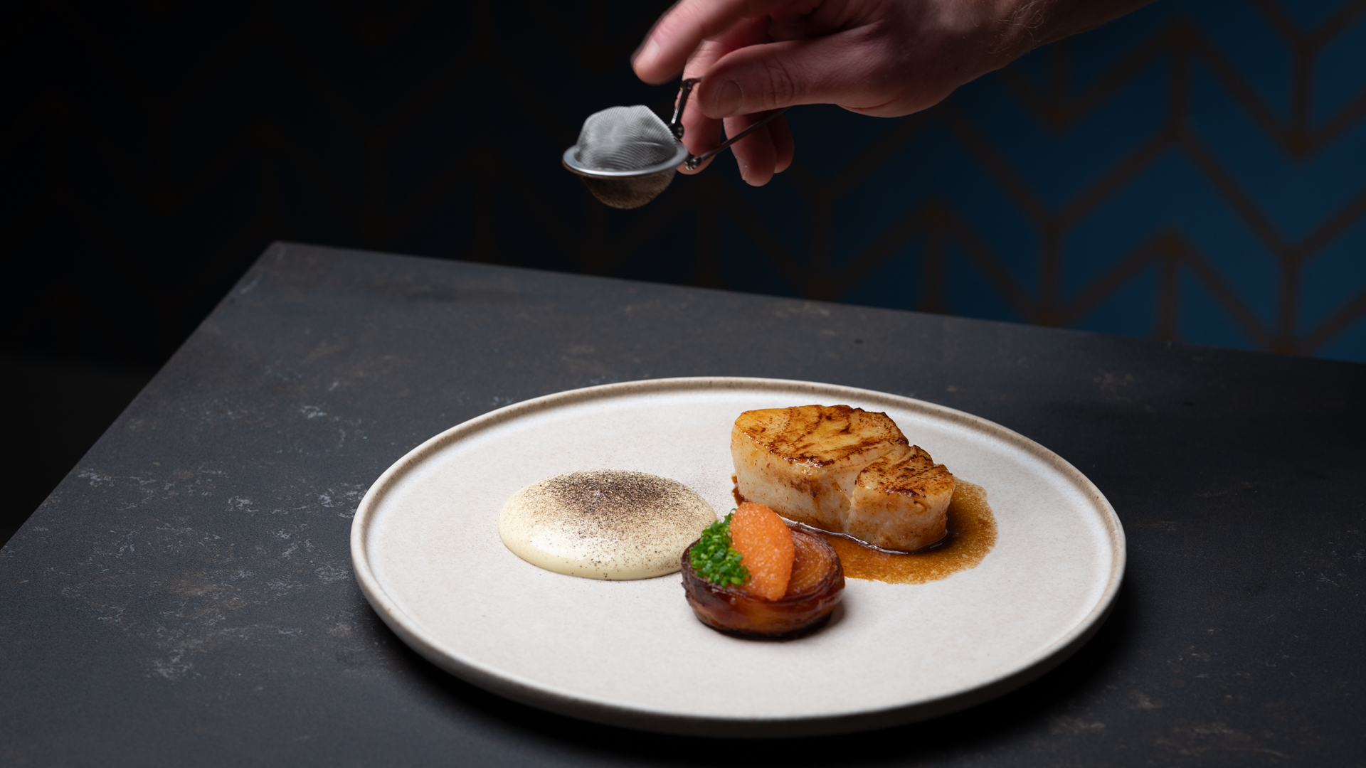 Fried Skrei cod loin, crispy potatoes, leek foam, onion roe and lemon ...